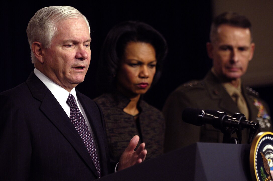 Defense Secretary Robert Gates, left, accompanied by Secretary of State ...