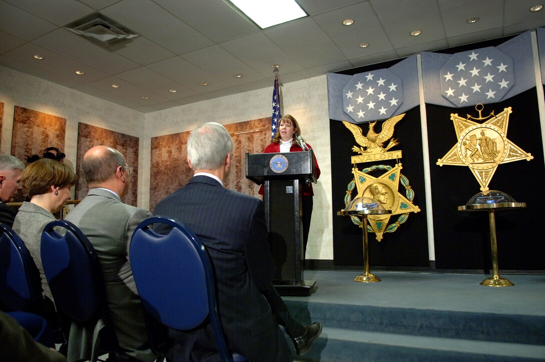 Deb Dunham speaks to those gathered at the Pentagon Hall of Heroes ...