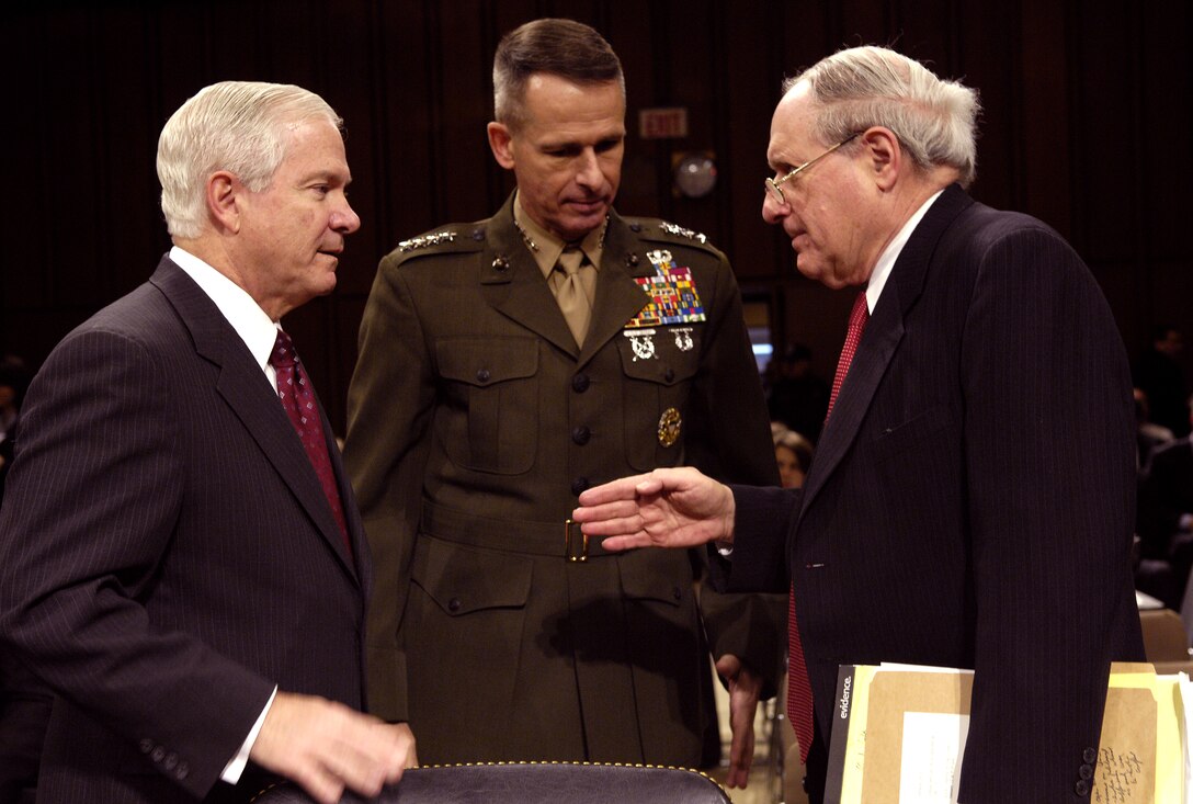 Chairman of the Senate Armed Services Committee, Carl Levin, right ...