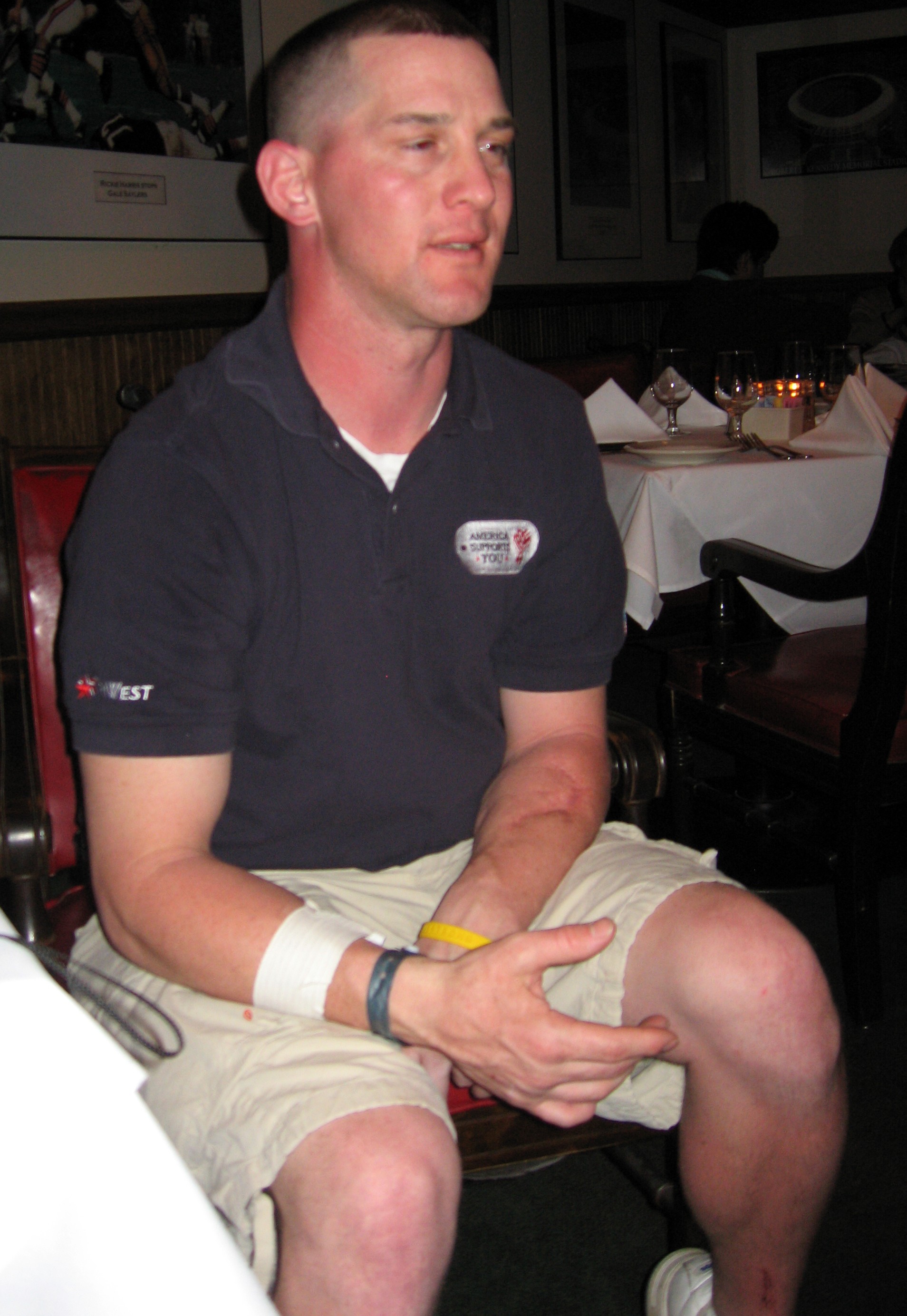 Army Staff Sgt. Chris Bain talks to reporters before the final Friday ...