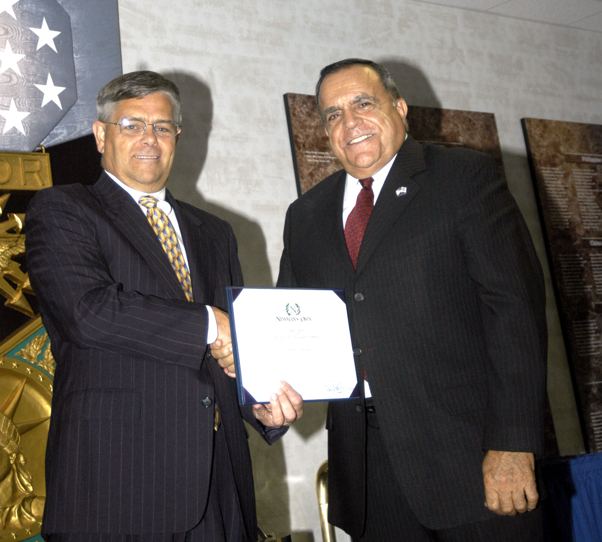 Retired Navy Capt. Bob Silah (right), president of the Tampa Chapter of ...
