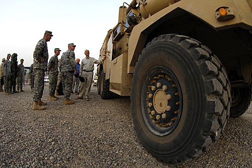 Deputy Secretary of Defense Gordon R. England listens to the ...