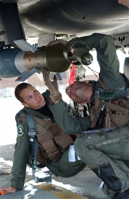 Capt. Chris Beery watches Capt. Kevin Pritz perform a pre-flight check ...