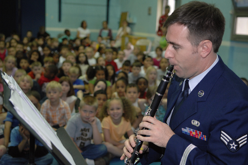 SrA Greg Gallant performing for students at Aviano Air Base