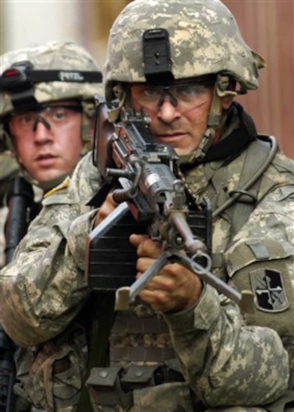 Soldiers combine efforts during a joint urban cordon and search ...