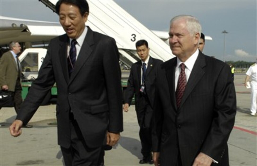 GATES ARRIVES IN SINGAPORE