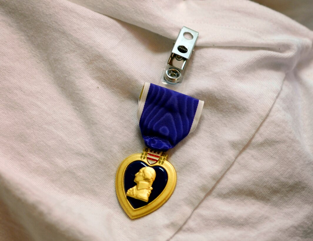 A Purple Heart medal is pinned to the chest of U.S. Army Staff Sgt ...