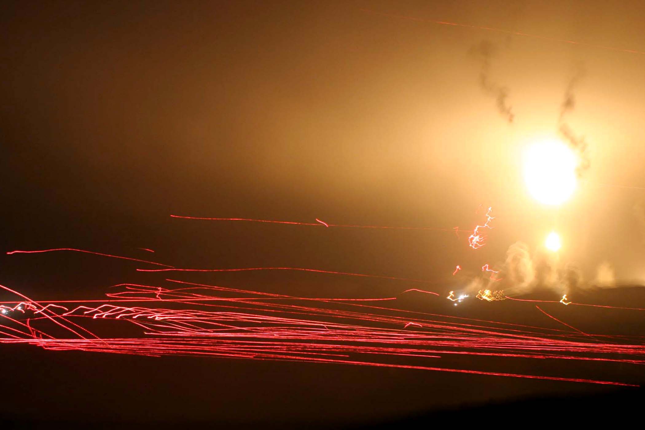 15 Fiery Photos Of Tracer Bullets Lighting Up The Sky