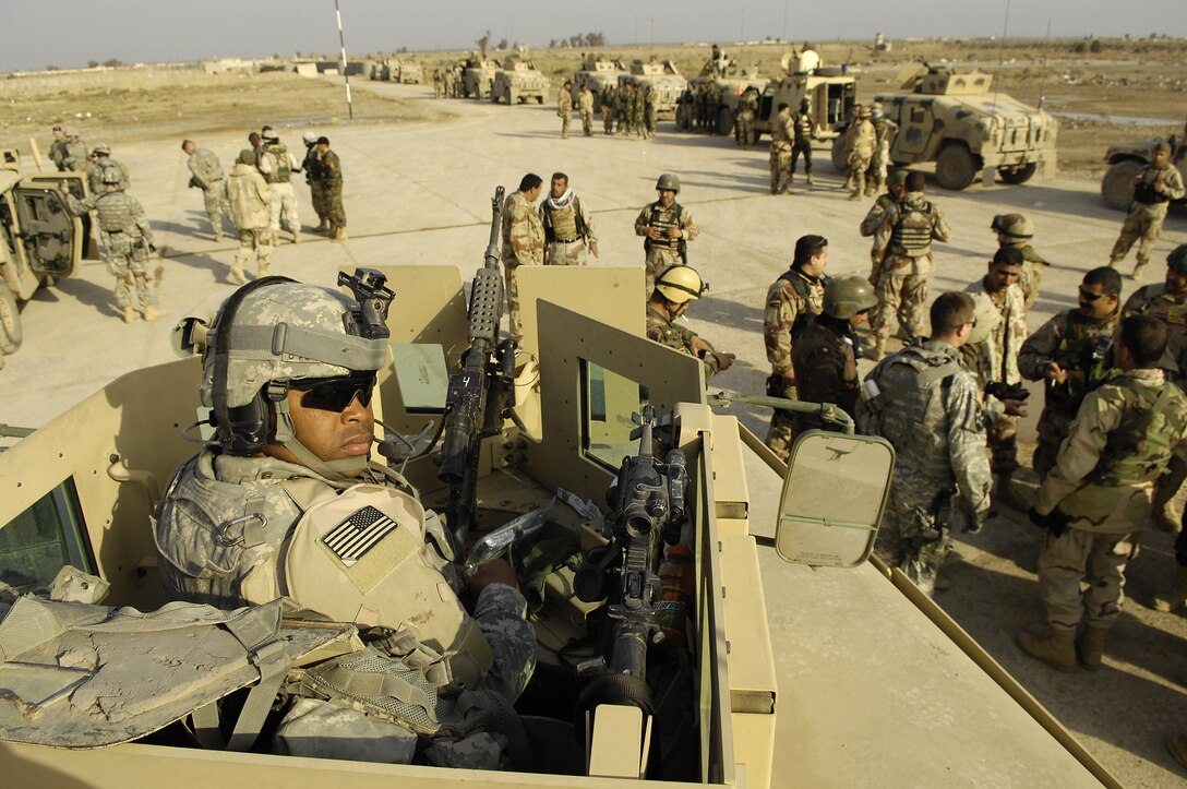 U.S. Army Staff Sgt. Charles Holland, assigned to the Military ...