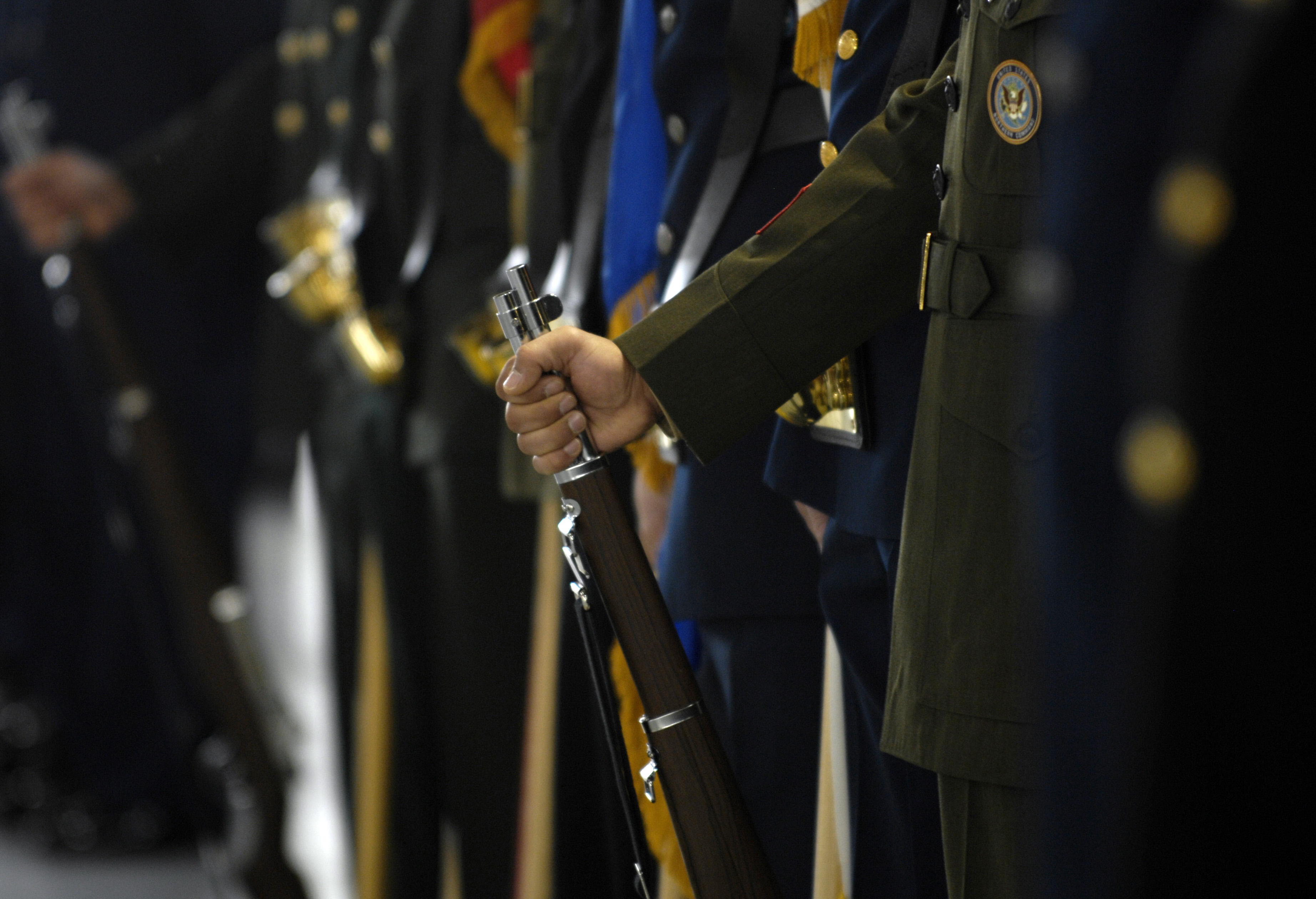 Members of a joint color guard stand at parade rest during the U.S ...