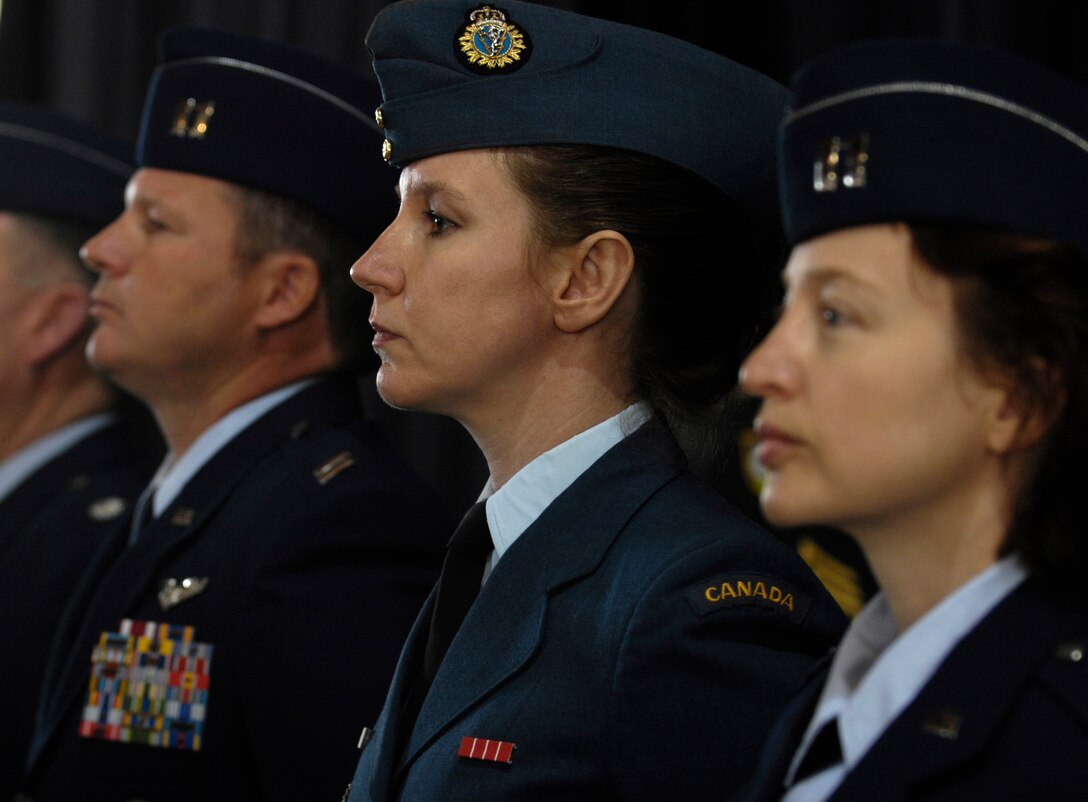 Members of North American Aerospace Defense Command (NORAD) stand at ...