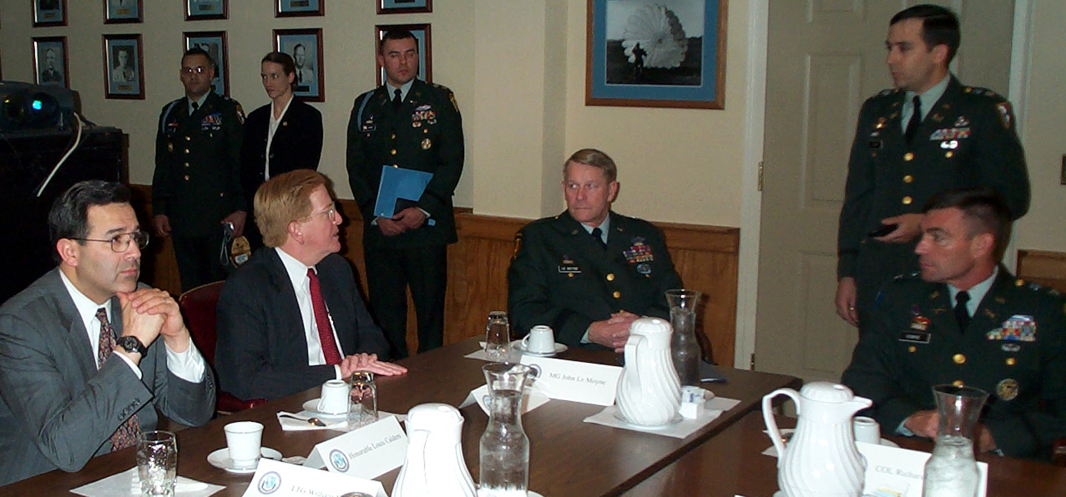 Left to right seated at table) Secretary of the Army Louis Caldera ...