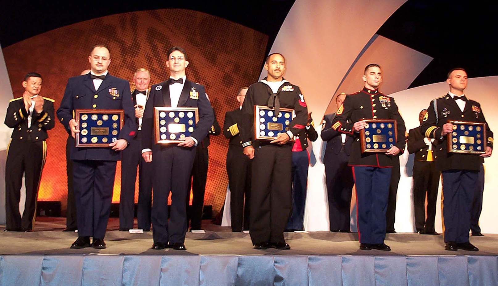 Five USO Service Members of the Year hold their awards at the USO's ...