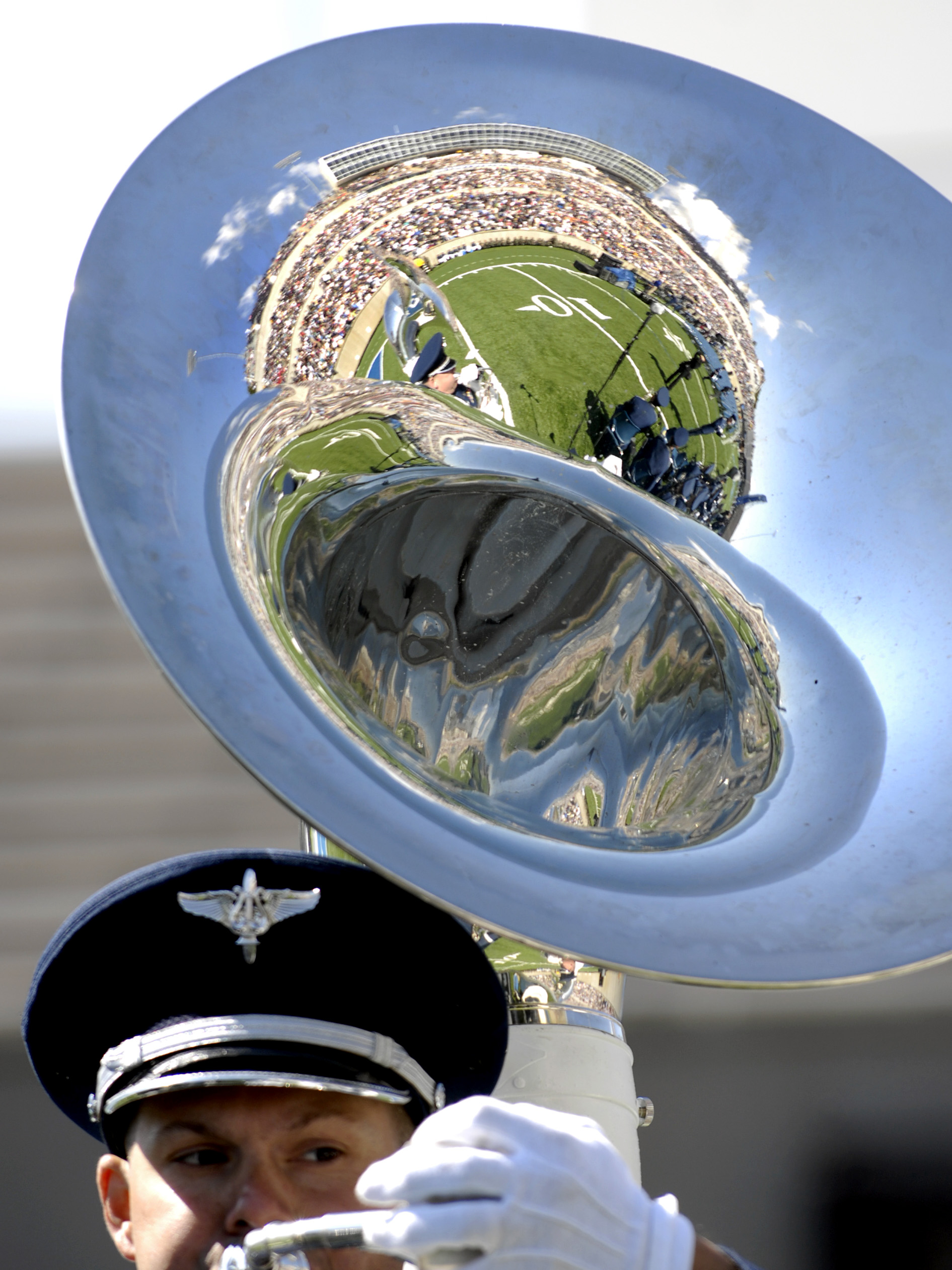 A band member's tuba reflects the stadium where the U.S. Air Force ...