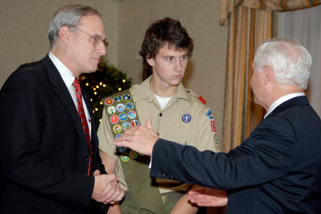 Defense Secretary Robert M. Gates speaks with Eagle Scout Adam Evans ...