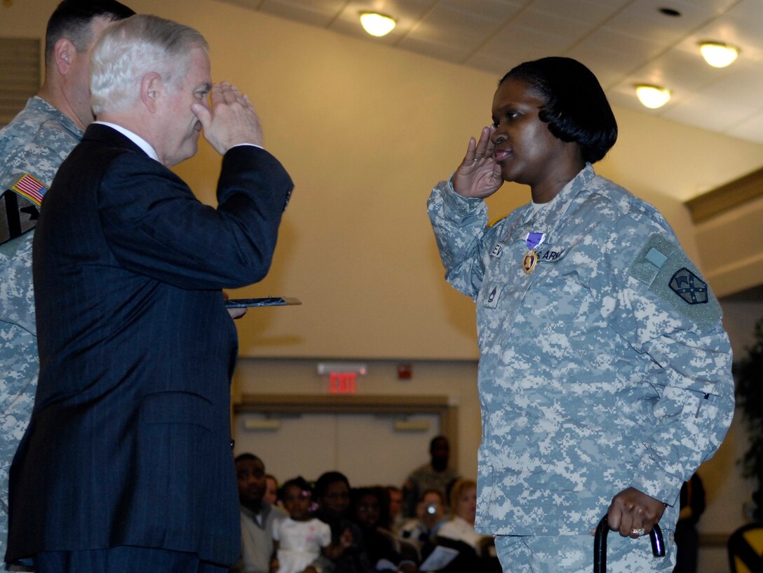 U.S. Army Sgt. 1st Class Winifred Lewis salutes Defense Secretary ...