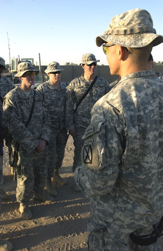 U.S. Army Command Sgt. Maj. Michael Grinston talks with his instructors ...