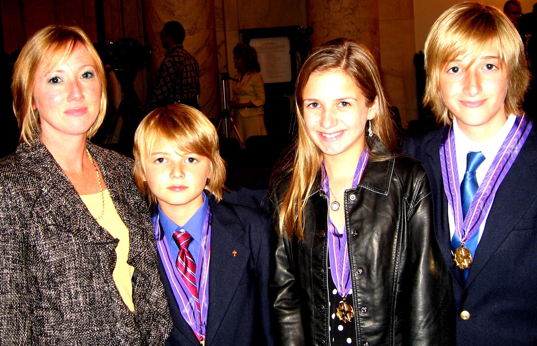 Left to right: Beth Downs and her children Bailey, 10, Elle, 11, and ...