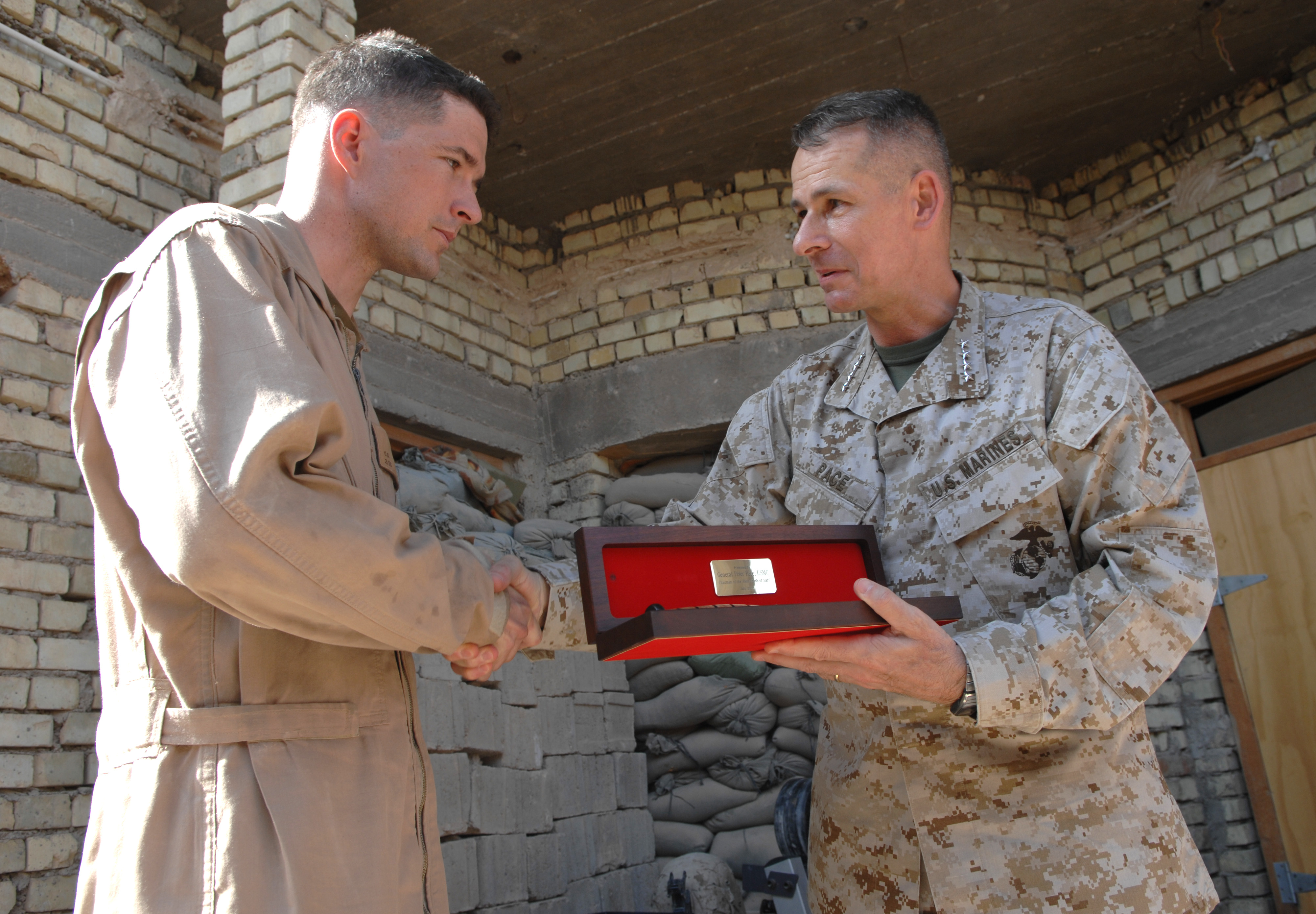 Marine Gen. Peter Pace, chairman of the Joint Chiefs of Staff, presents ...