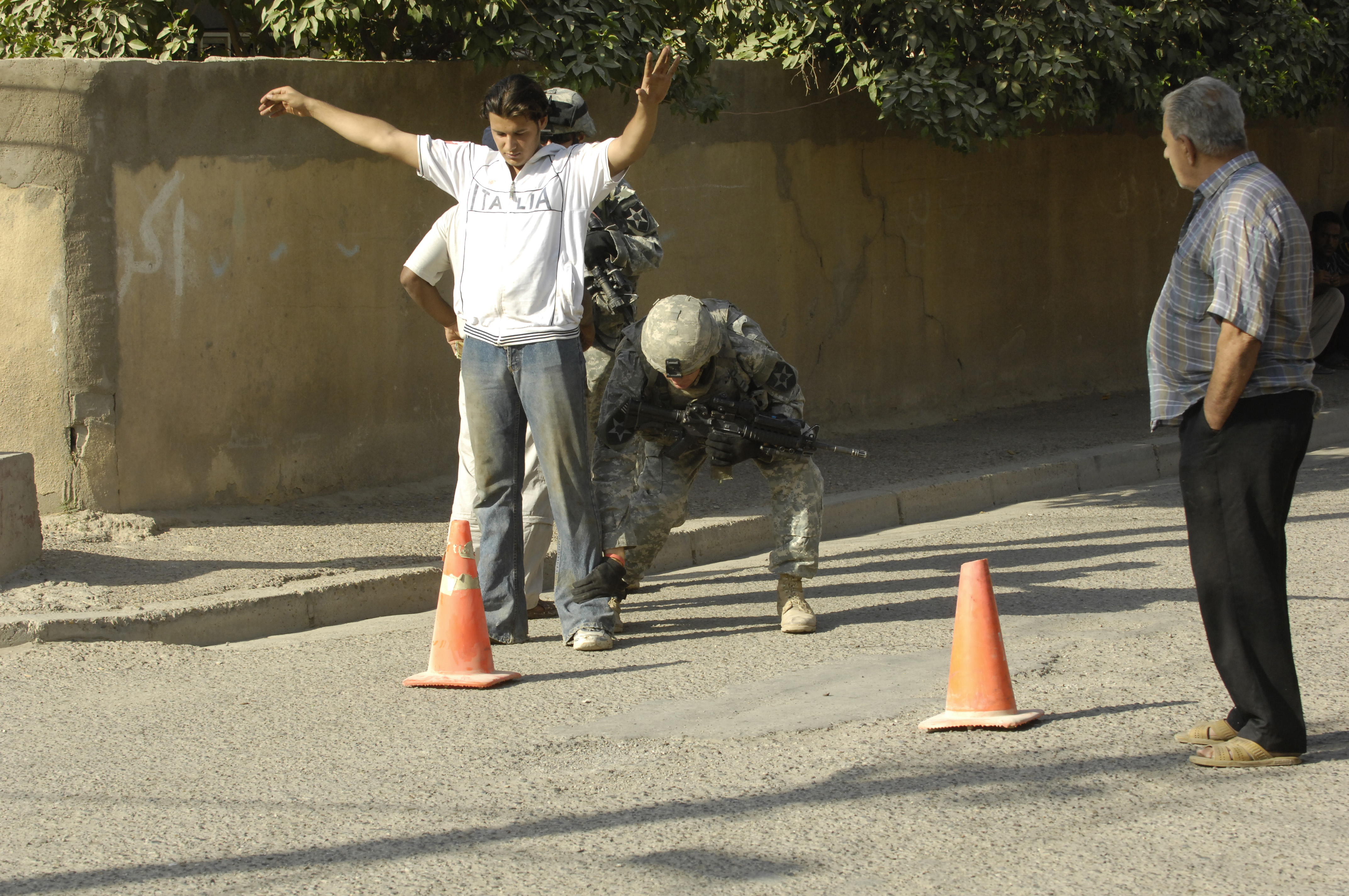 U.S. Army soldiers man a checkpoint in the city of Dora in Southern ...