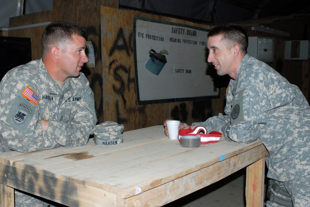 Army Staff Sgt. Shane Hansen (left), a section sergeant in Company D ...
