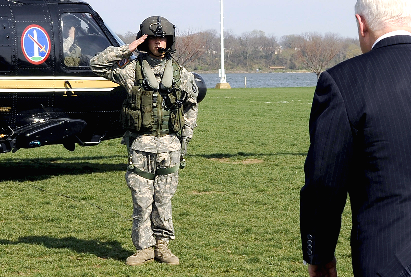 U.S. Army Spc. Patrick Martin salutes Defense Secretary Robert M. Gates ...
