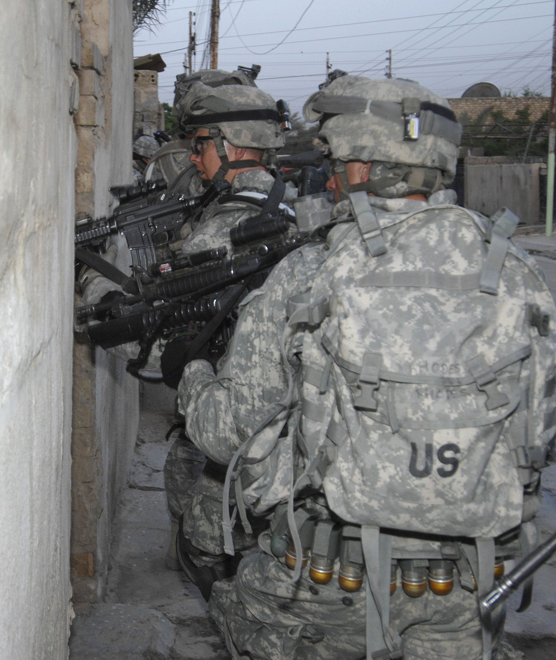 U.S. Army Soldiers enter a house in search of weapons caches in Al ...