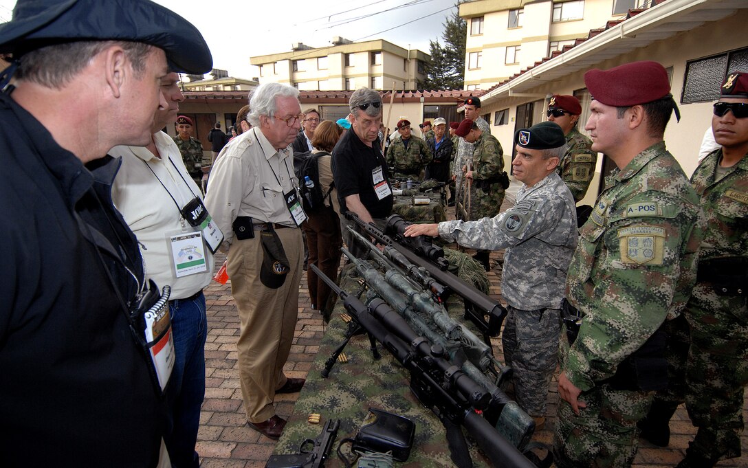 Colombian special forces members display and explain military hardware ...