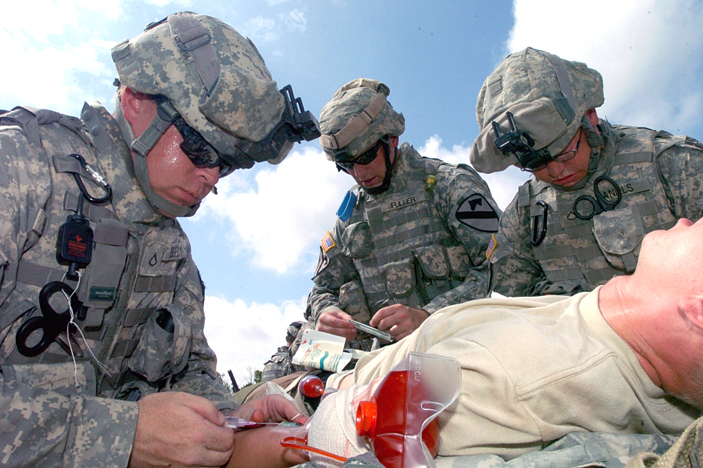 U.S. Army Pfc. Adam Bigelow, left, Spc. Mark Fuller, center, and Pfc ...
