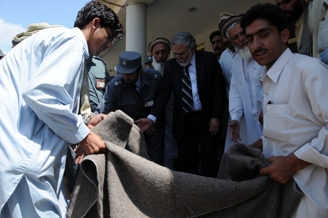 Gov. Sayed Wahidi of Afghanistan’s Konar province distributes ...