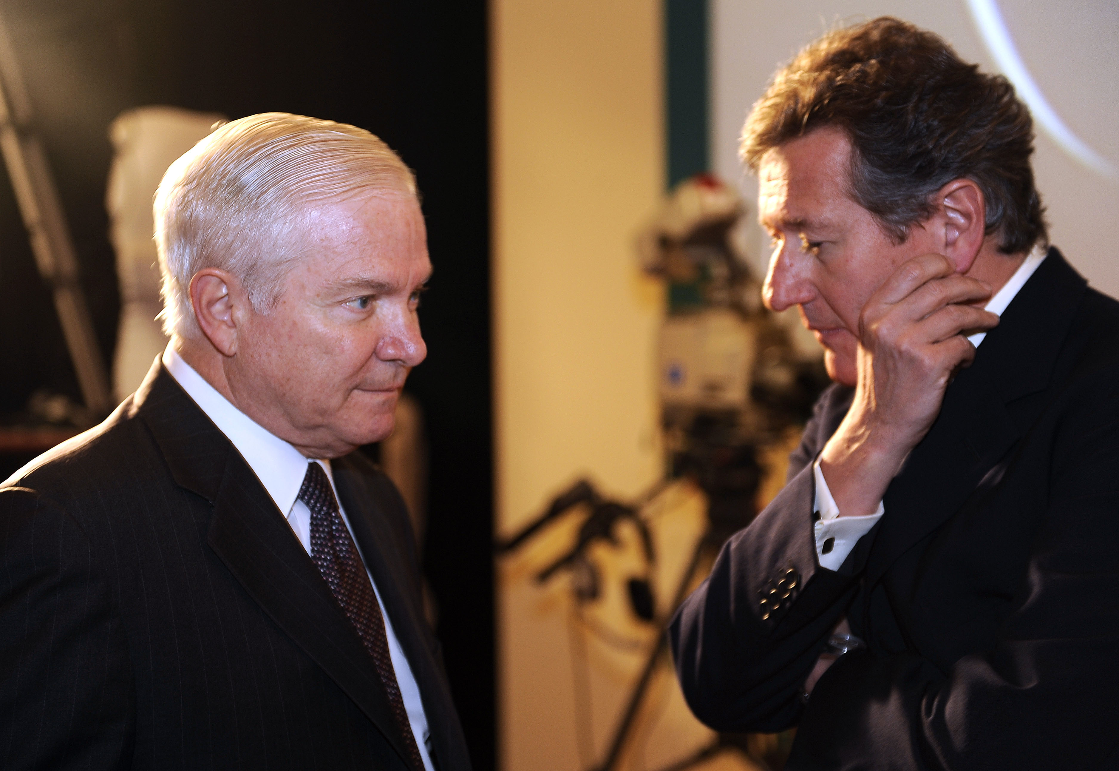 U.S. Defense Secretary Robert M. Gates, left, talks with John Chipman ...