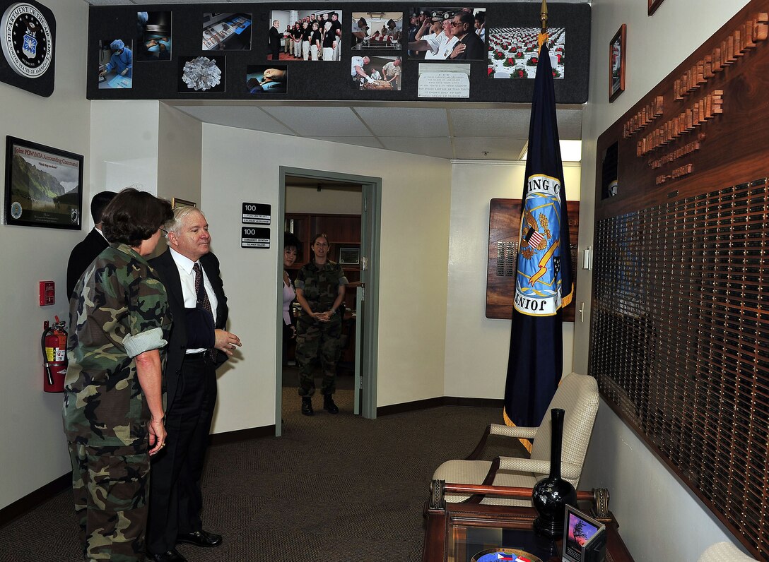 Defense Secretary Robert M. Gates talks with Rear Admiral Donna Crisp ...