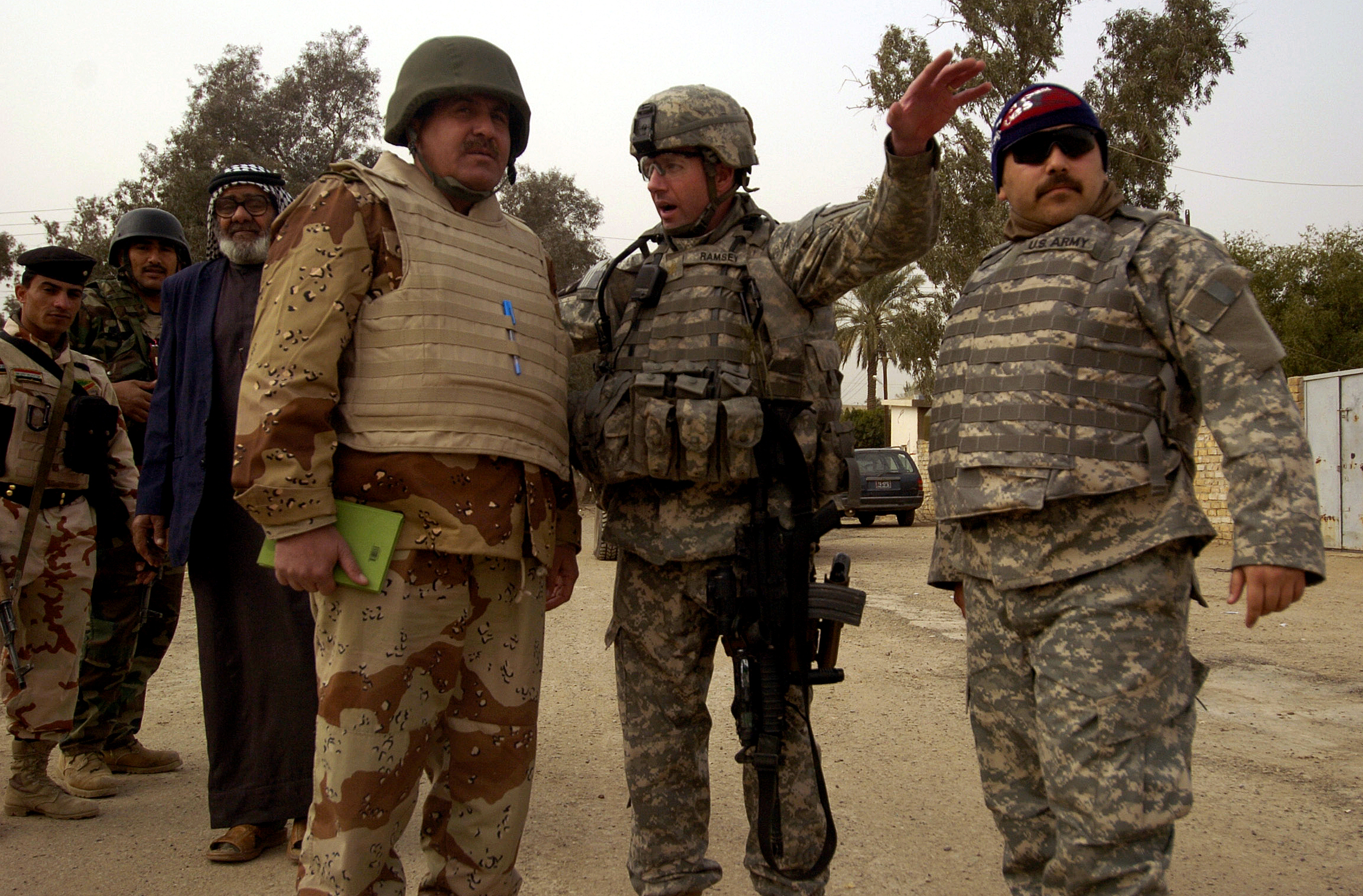 Iraqi army Col. Shaker and U.S. Army Maj. Rich Ramsey discuss security ...
