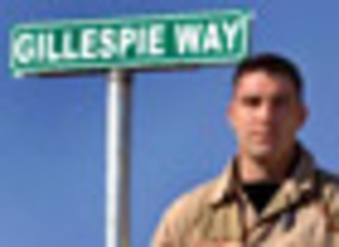 Photo: U.S. Air Force Tech Sgt. Blaine Arsenault stands by sign ...
