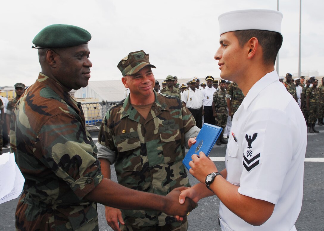 Capt. Paul Biving Nziengui (left), chief of Gabonese Naval Forces ...