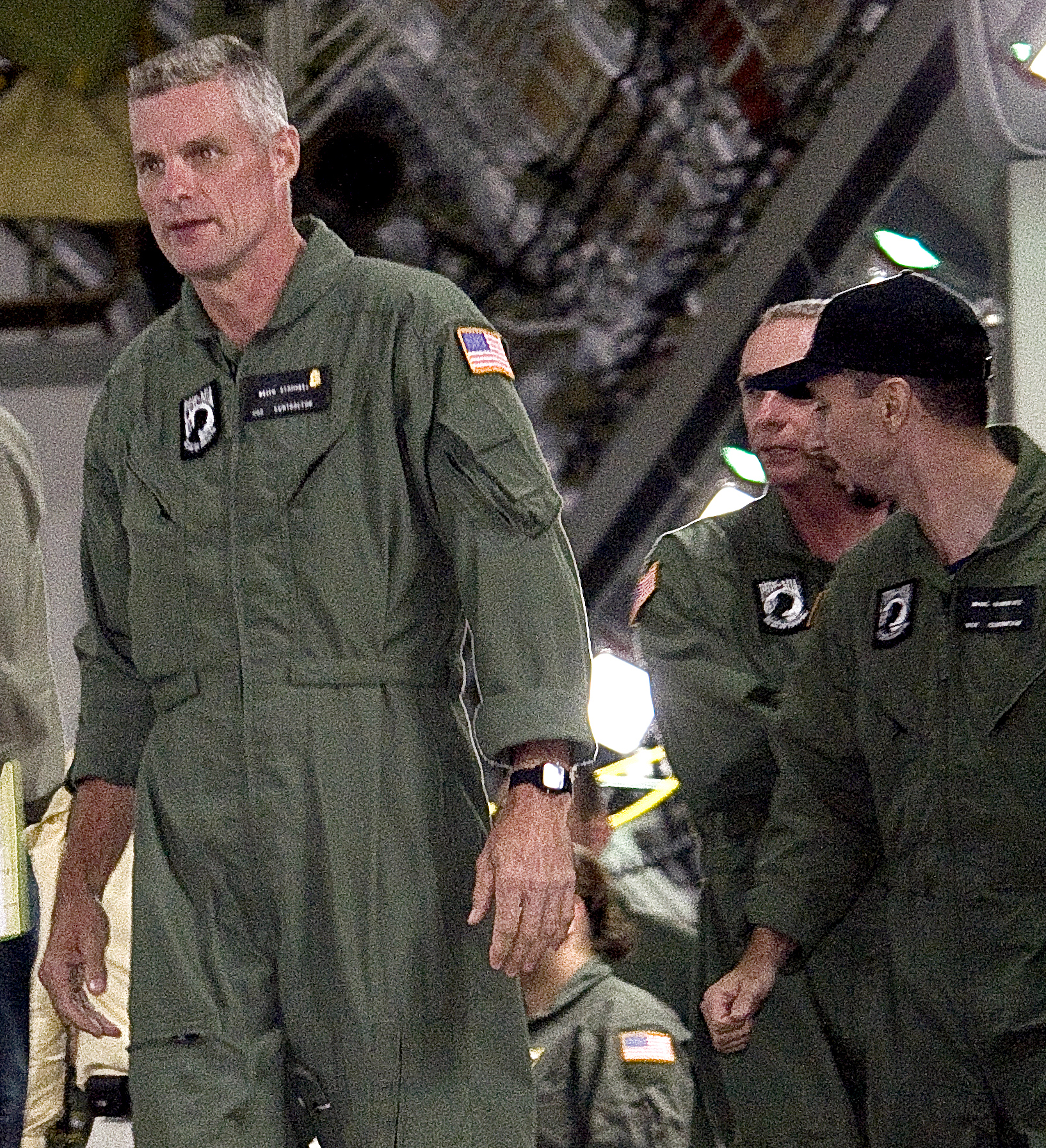 Keith Stansell, left, Marc Gonsalves, center, and Thomas Howes prepare ...