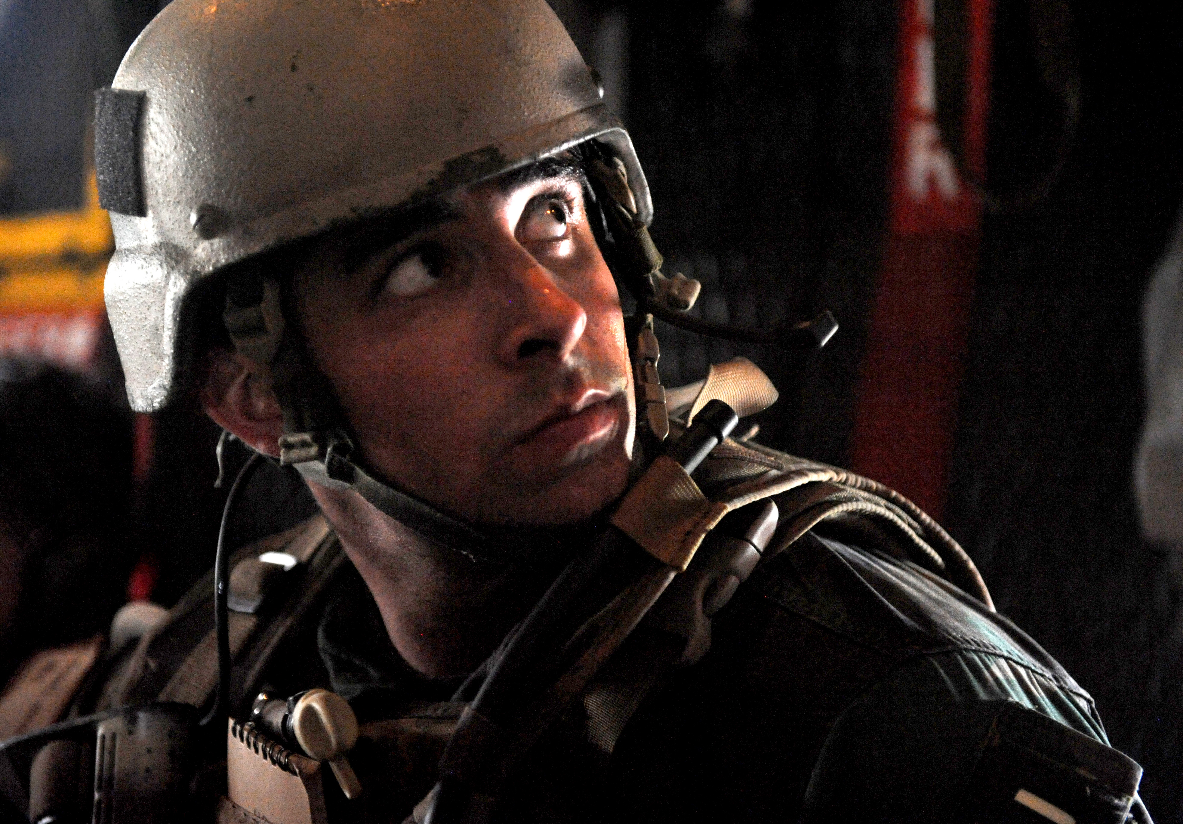 U.S. Air Force Staff Sgt. Daniel Houghton takes a break after loading ...