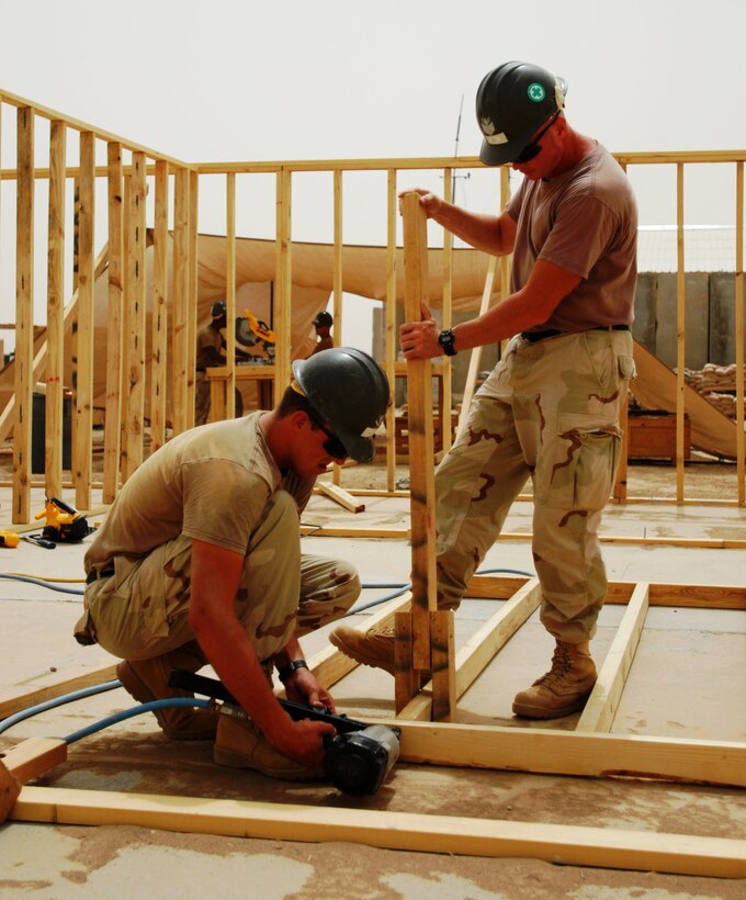 Navy Petty Officer 2nd Class Kristopher Maleport, an engineer aide, and ...