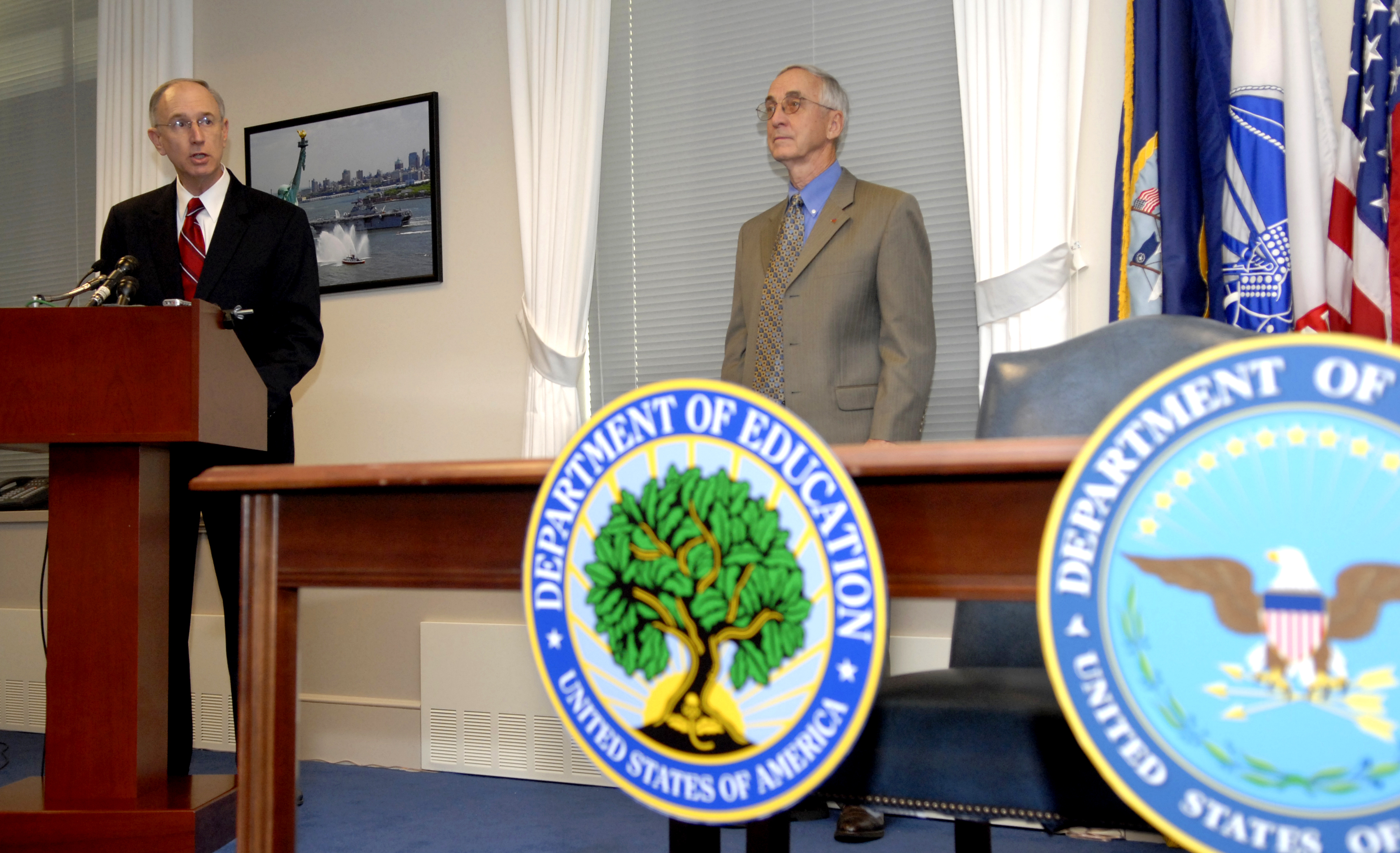 Deputy Secretary of Education Raymond Simon speaks at the podium while ...