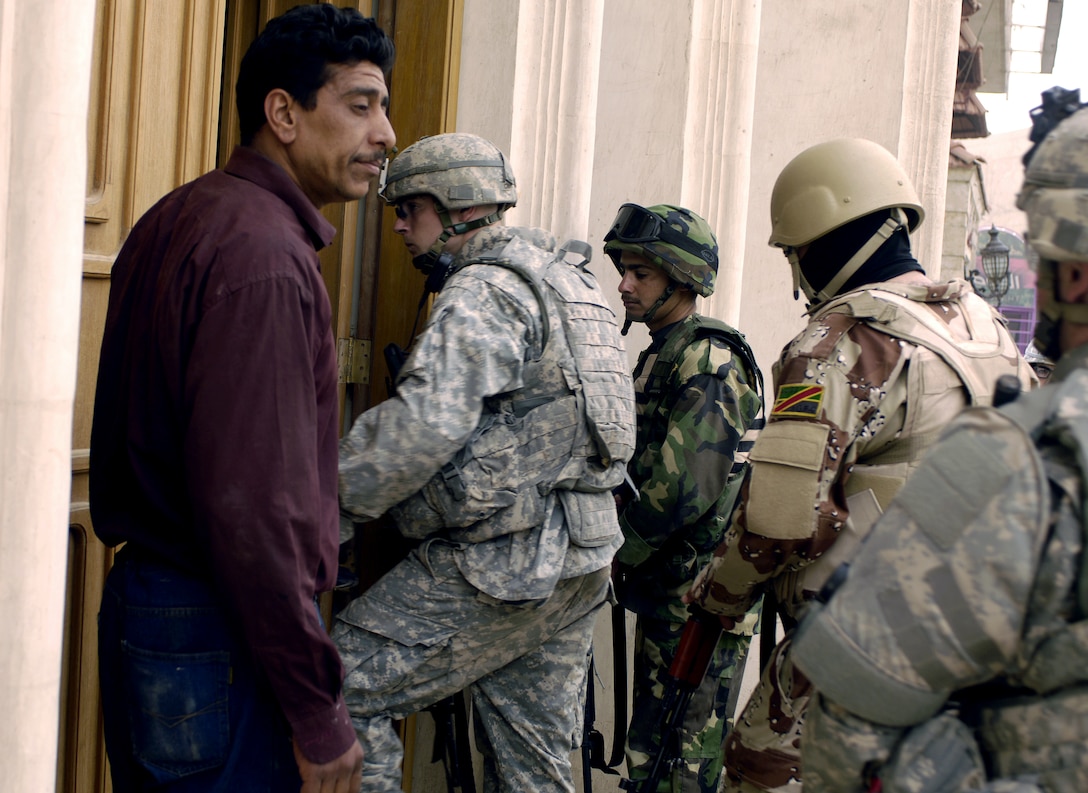 U.S. Army soldiers Iraqi National Police and Iraqi army soldiers enter ...