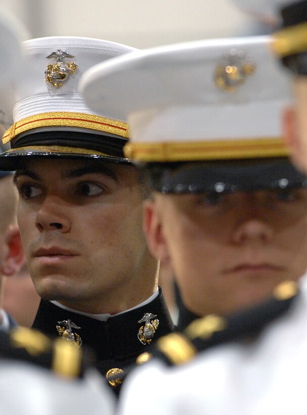 A newly commissioned Marine second lieutenant watches events during the ...