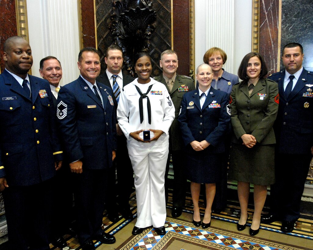 President's Volunteer Service Awards winners and presenters pose for a ...