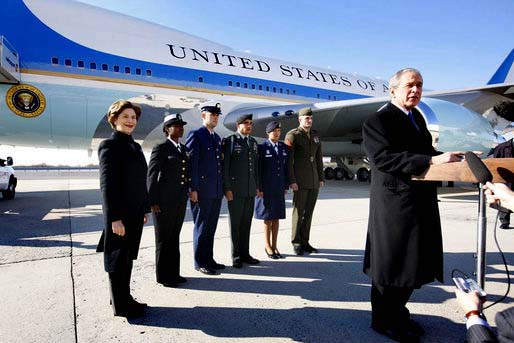 President George W. Bush, joined by Laura Bush, stands outside Air ...