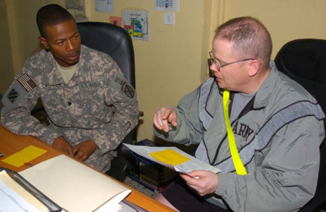 Army Spc. Anthony Calhoun, left, 10th Mountain Division Defense ...