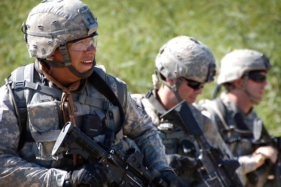 U.S. Army Sgt. 1st Class Victor Benavides takes a break along with ...