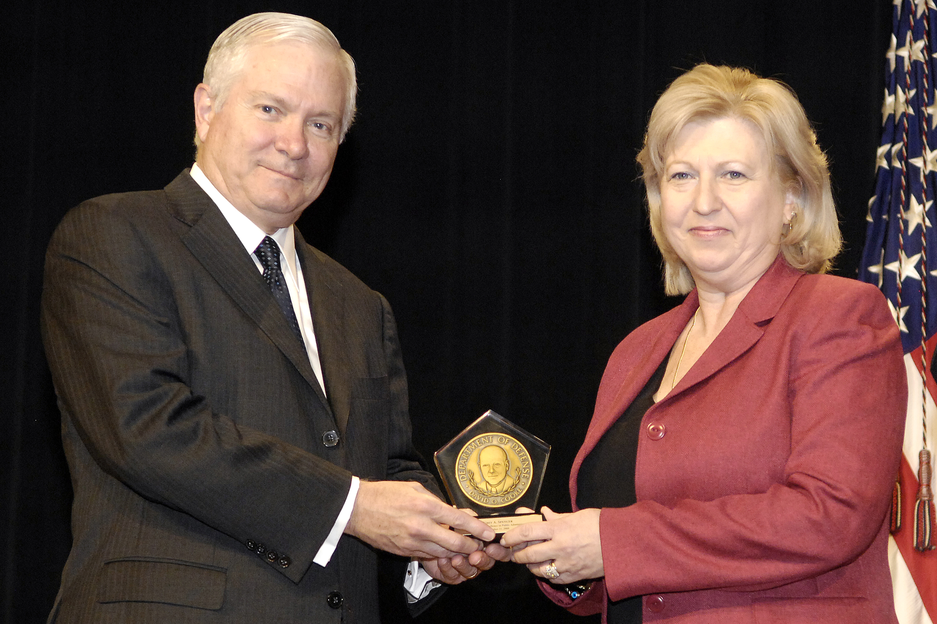 Defense Secretary Robert M. Gates presents Umit A. Spencer the David O ...