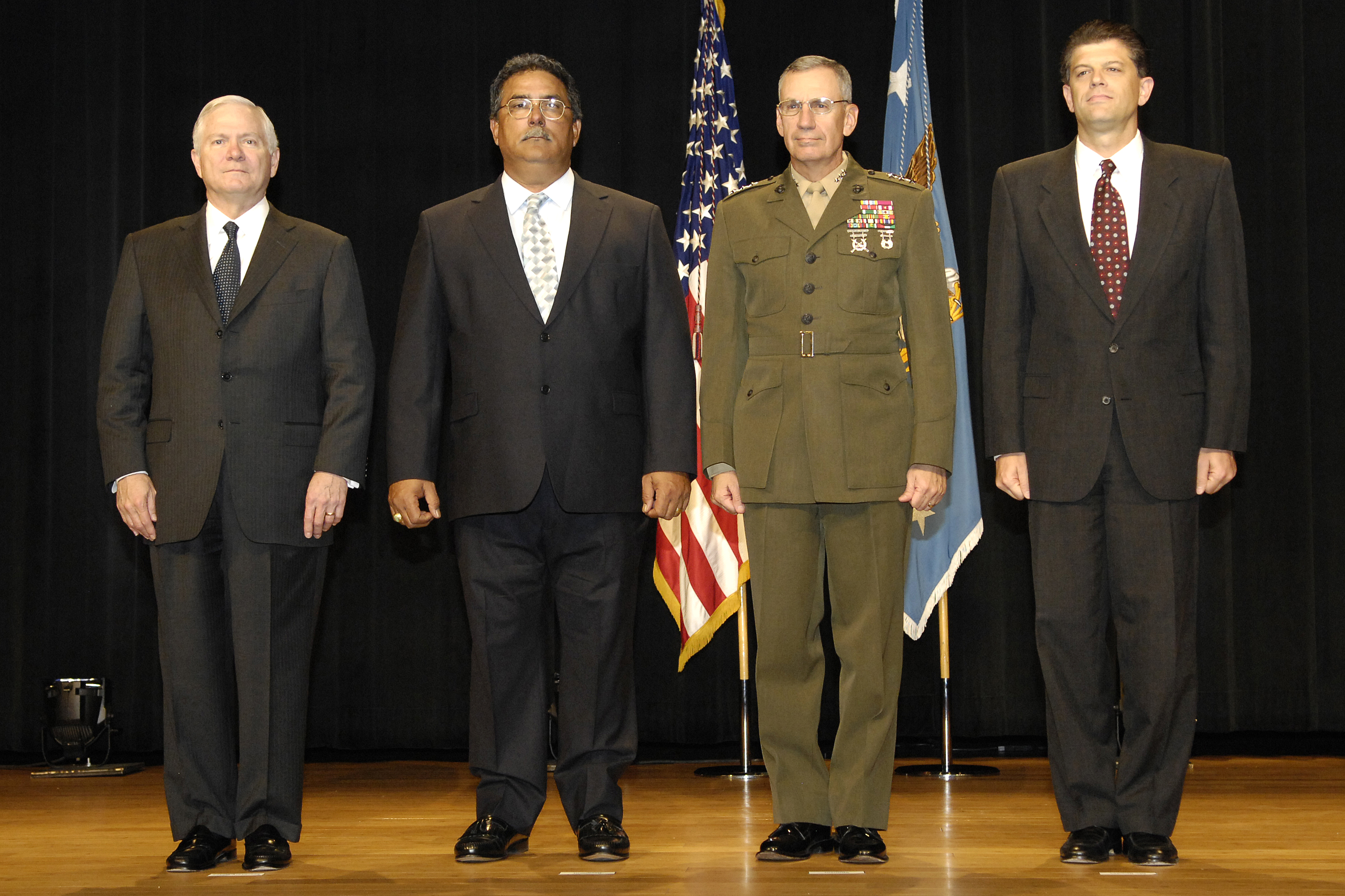 Defense Secretary Robert M. Gates, left, prepares to present John K ...