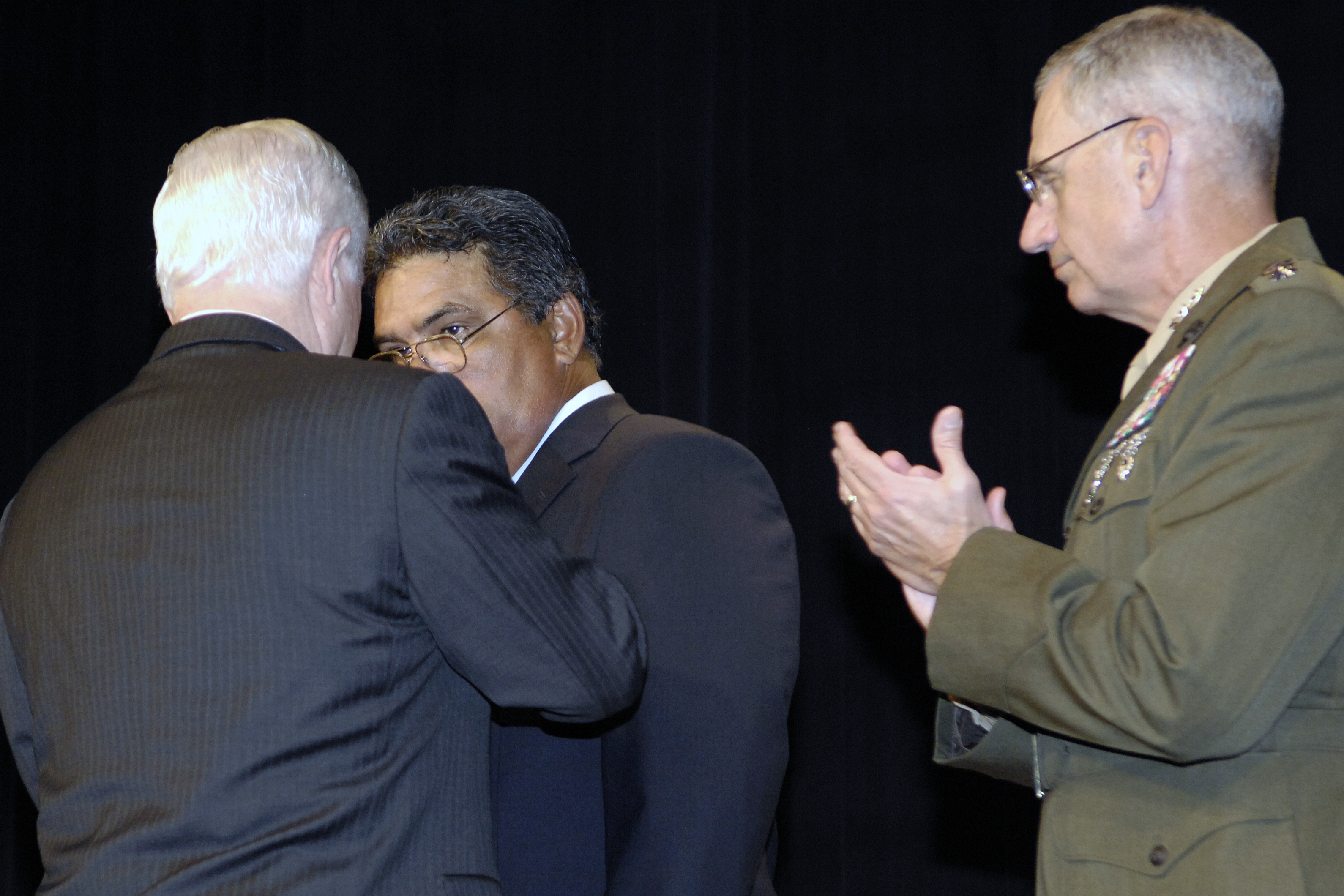 Defense Secretary Robert M. Gates, left, presents John K. Russell ...
