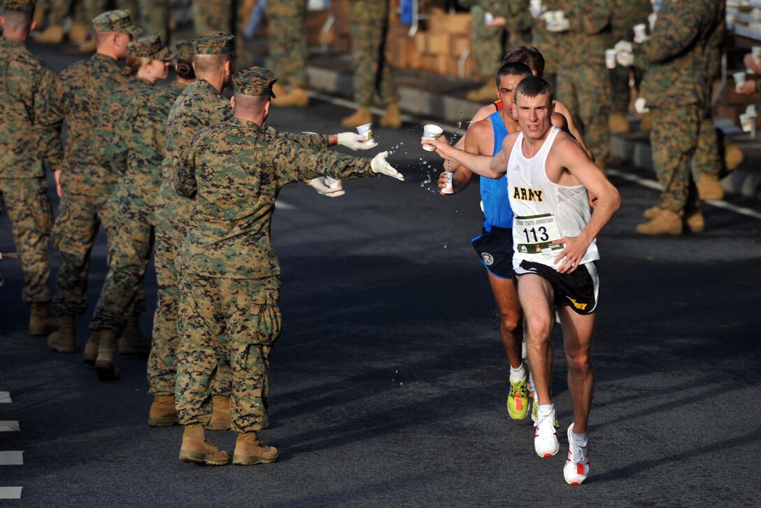 U.S. Army 2nd Lt. Kenneth Foster and Jose Miranda of Mexico receive ...