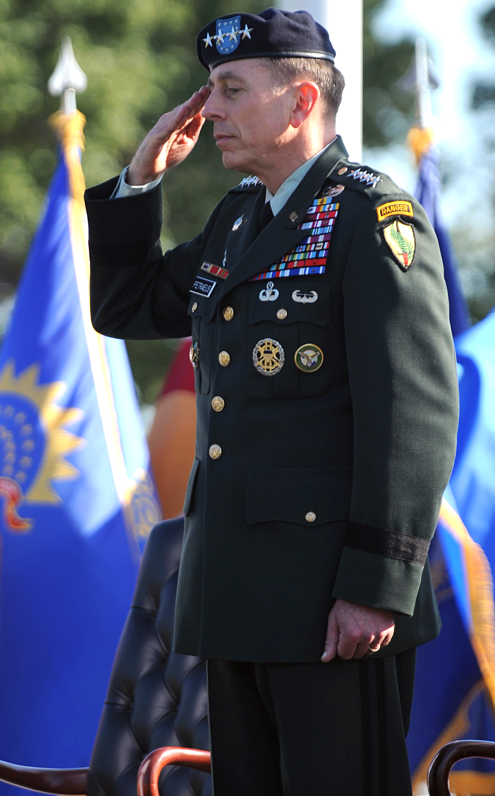 U.S. Army Gen. David H. Petraeus salutes the colors during the playing ...